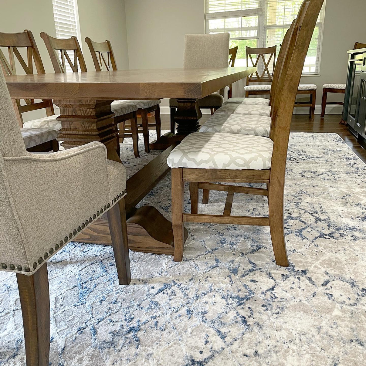 Pictured iwth a 9' L x 48" W Hickory table stained in espresso.